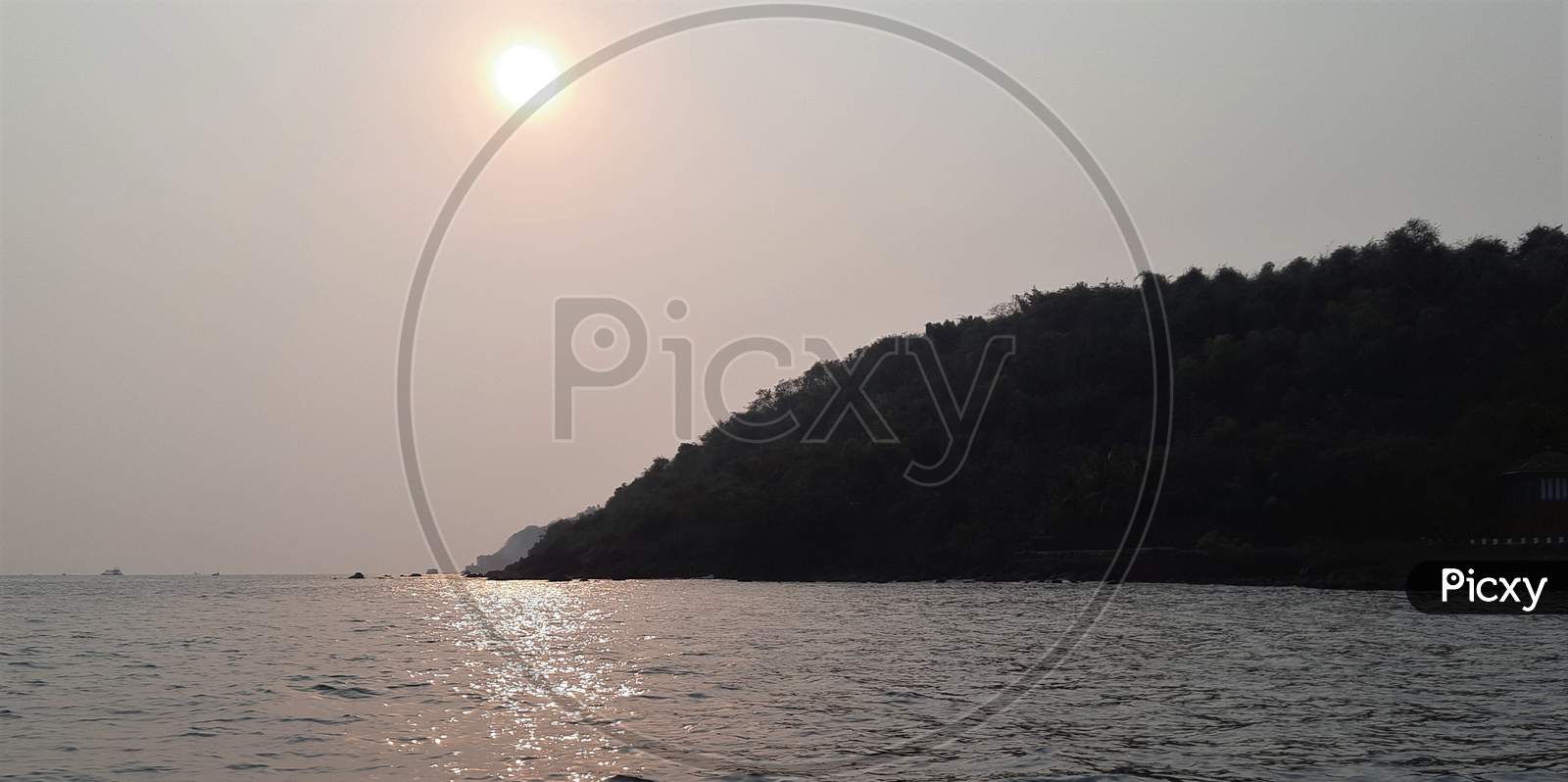 Image of A view of the setting sun, taken from dolphin point boat ride ...
