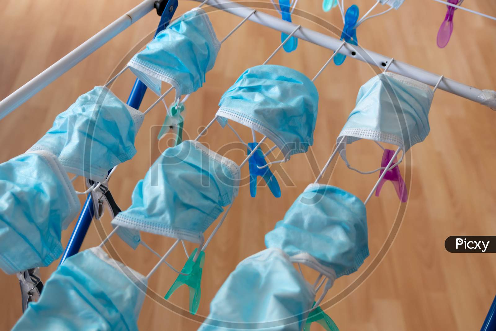 Image of Washed surgical masks hanging on a clothes drying rack after ...