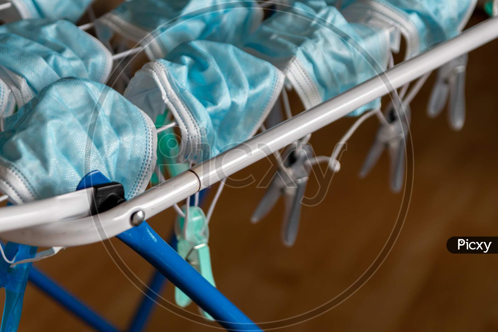 Image of Washed surgical masks hanging on a clothes drying rack after ...
