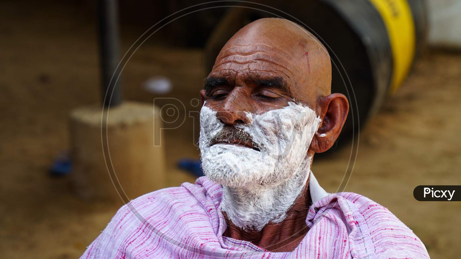 Image of A Traditional Barber Is Shaving A Man In Village Of Sikar ...