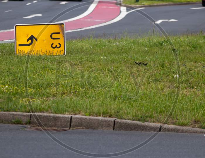Image of Yellow traffic sign for redirection on urban streets forces ...