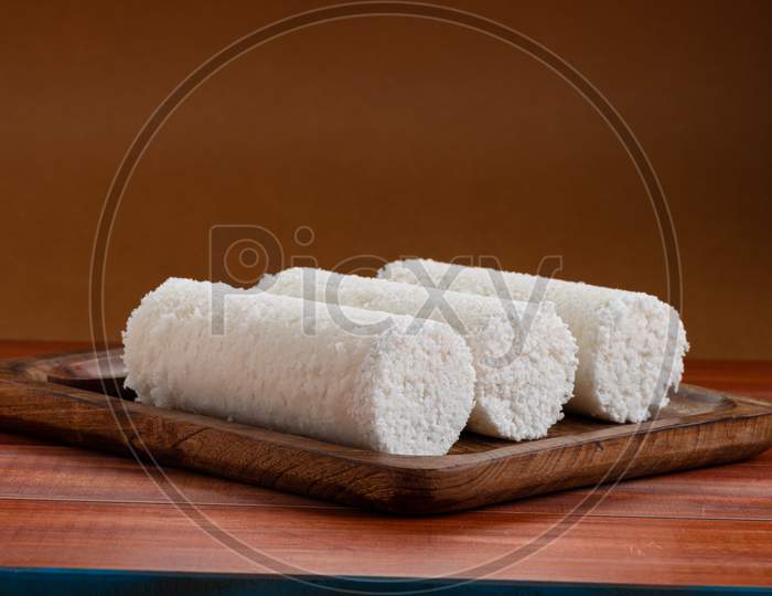 Image of Raw Rice Puttu_Pittu_Pachaarisi Maavu Puttu_Wooden Bg-YP028206 ...