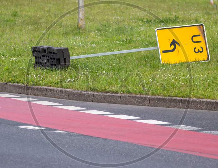 Image of Yellow traffic sign for redirection on urban streets forces ...
