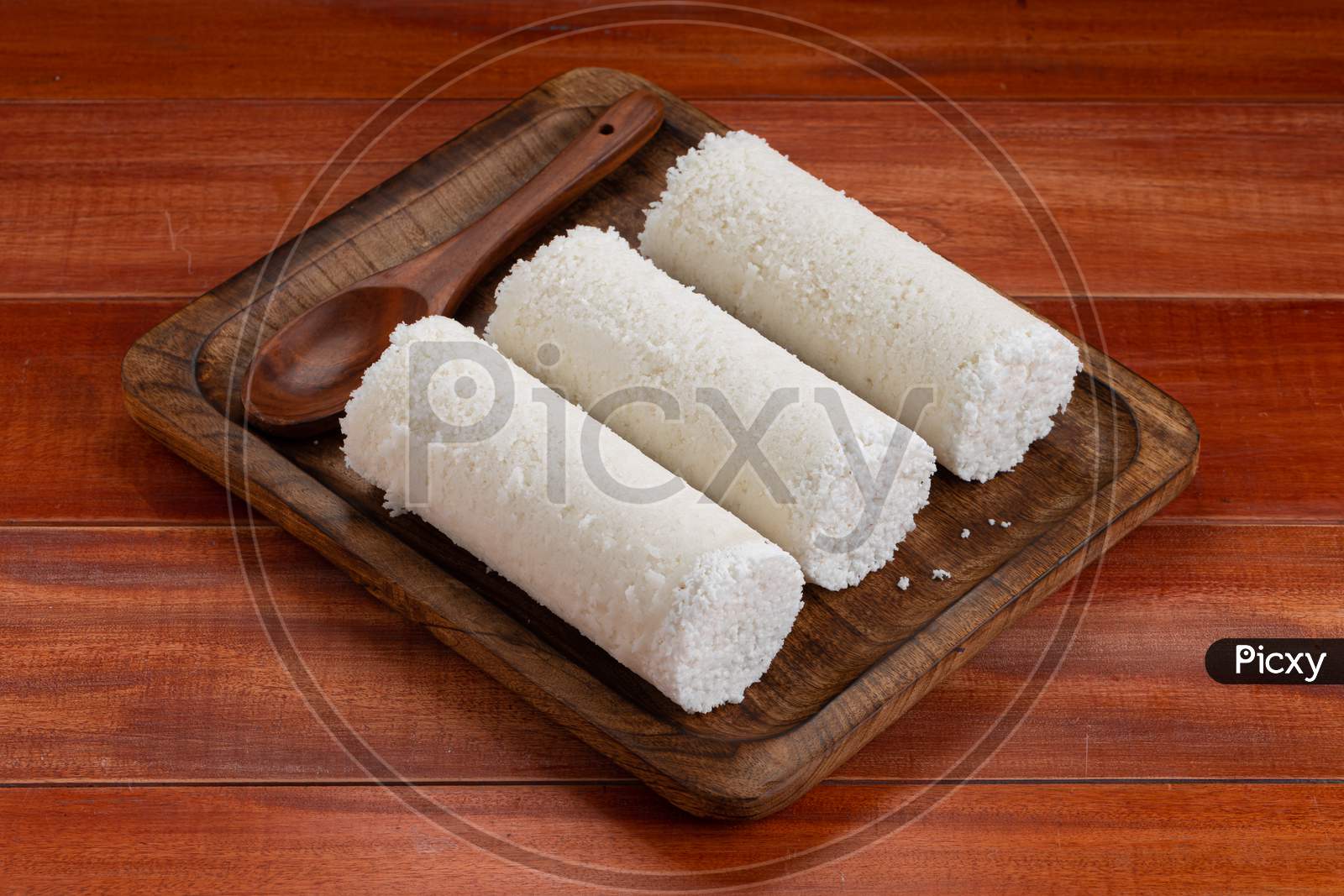 Image of Raw Rice Puttu_Pittu_Pachaarisi Maavu Puttu_Wooden Bg-YP028206 ...