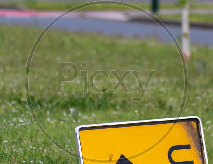 Image of Yellow traffic sign for redirection on urban streets forces ...