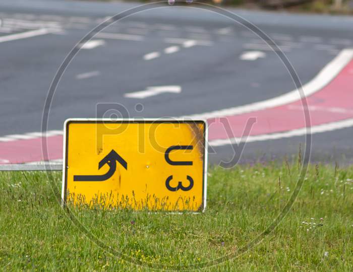 Image of Yellow traffic sign for redirection on urban streets forces ...
