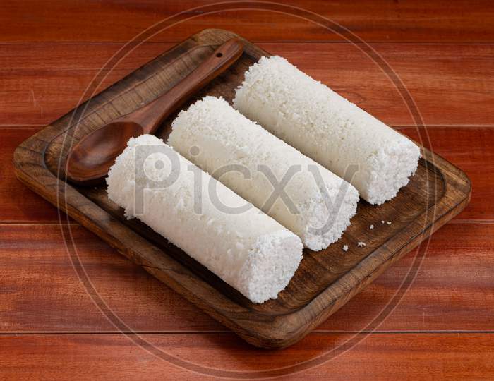 Image of Raw Rice Puttu_Pittu_Pachaarisi Maavu Puttu_Wooden Bg-YP028206 ...