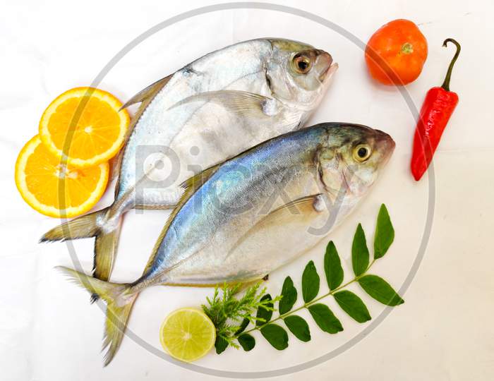 Image of Fresh Malabar Trevally Fish Decorated With Herbs And Fruits ...
