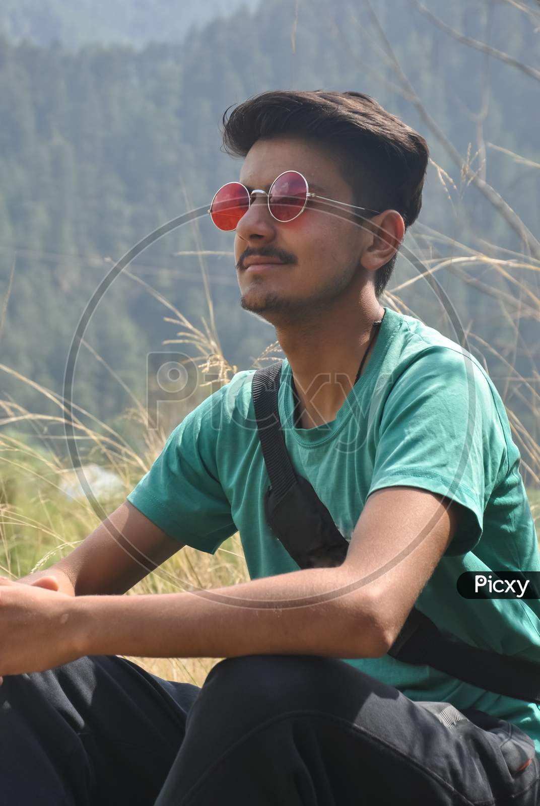 Image of Photo of a handsome Indian young guy wearing sunglass and ...