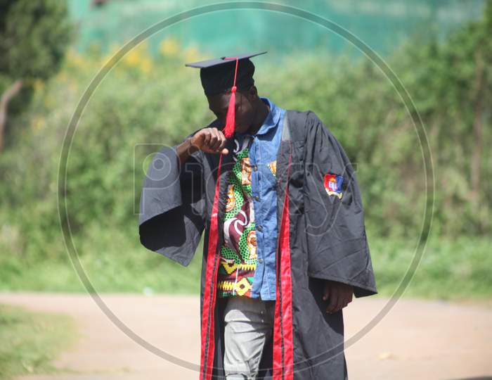 Image of Black American young man or grandaunt doing his graduation ...