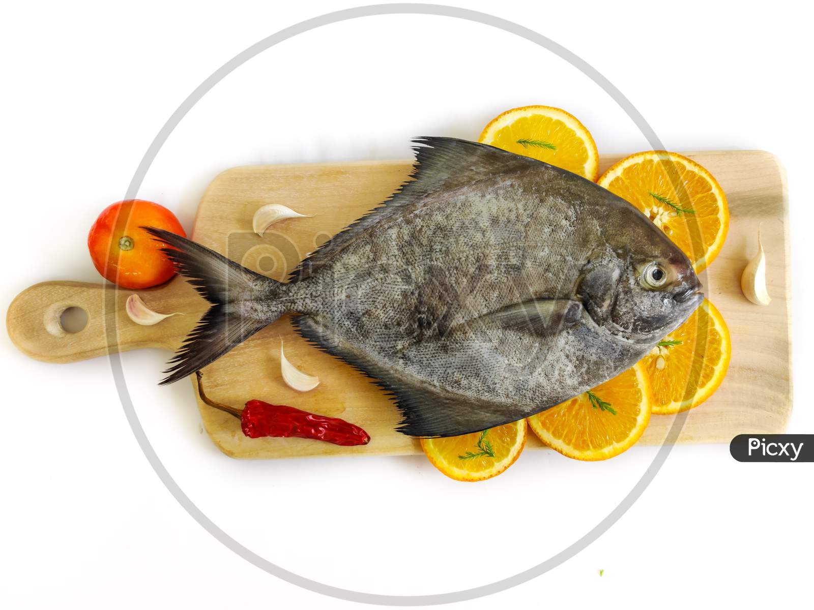 Image of Closeup View Of Black Pomfret Fish Decorated With Fruits And ...