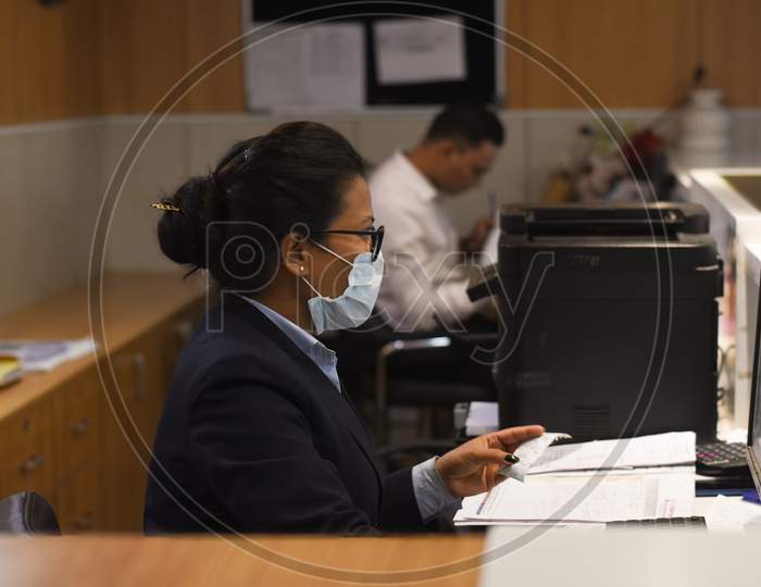 Image of Male receptionist doing his work at hospital reception in ...