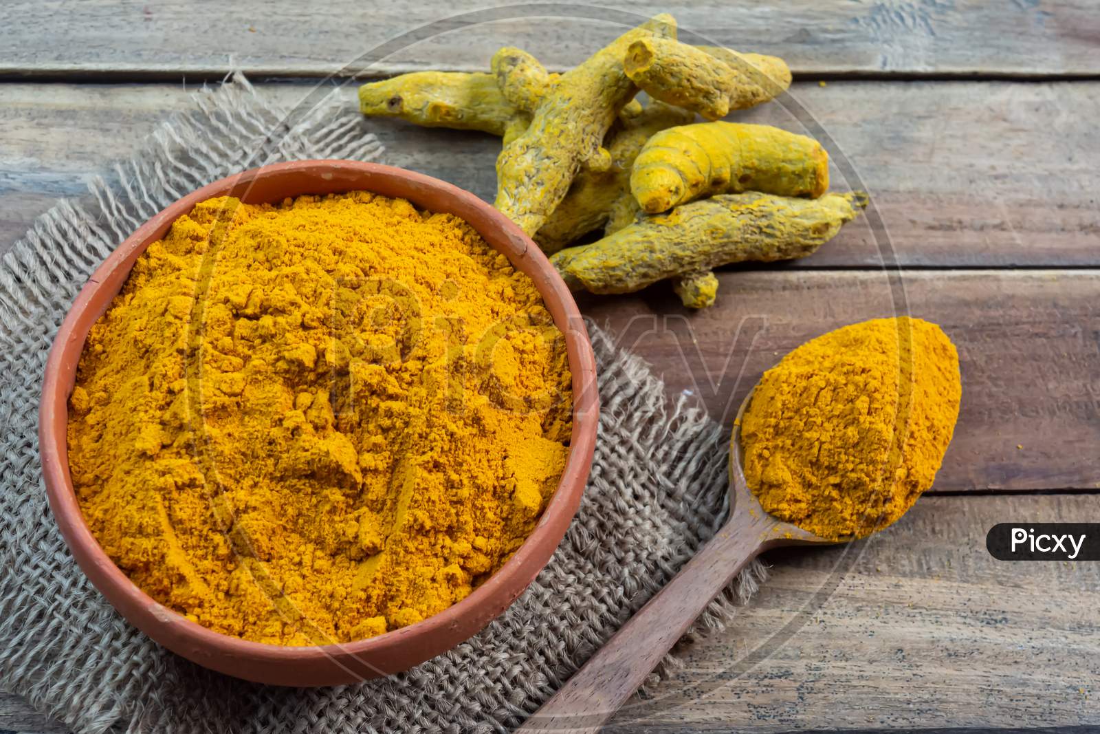 Image of Dry Turmeric Or Haldi Powder In A Earthen Bowl With Turmeric ...