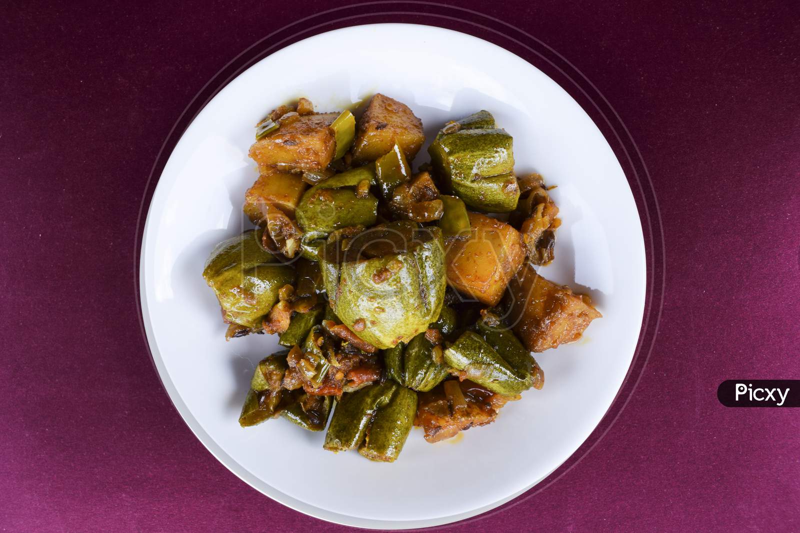 Image of Parwal Aloo Ki Sabji Also Known As Pointed Gourd And Potato ...