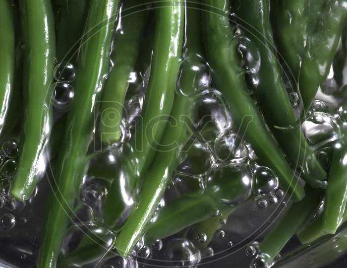 Image of closeup of boiling French beans in hot water.-OO063783-Picxy