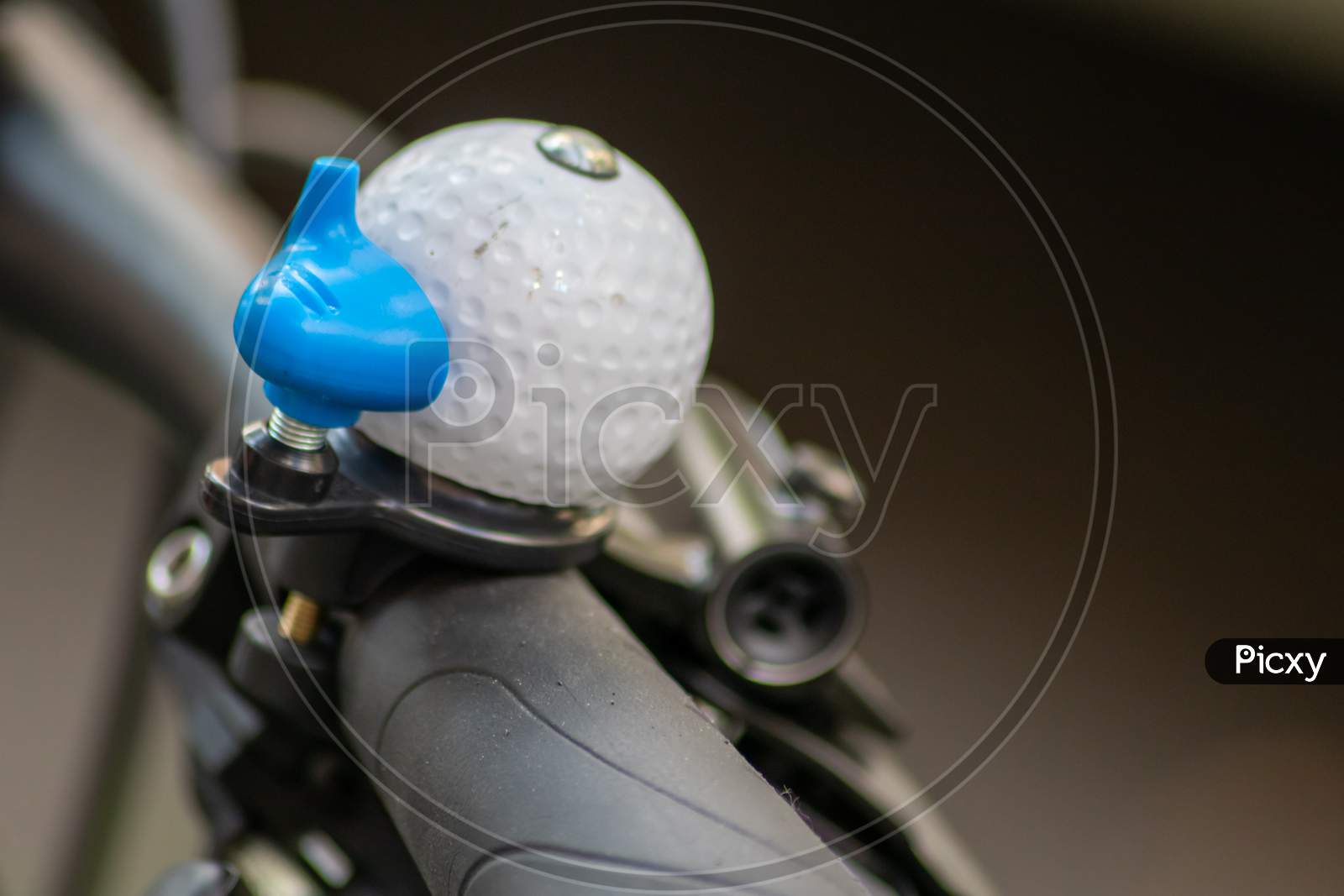Image of Beautiful golf ball and club bike bell ensures security in the ...