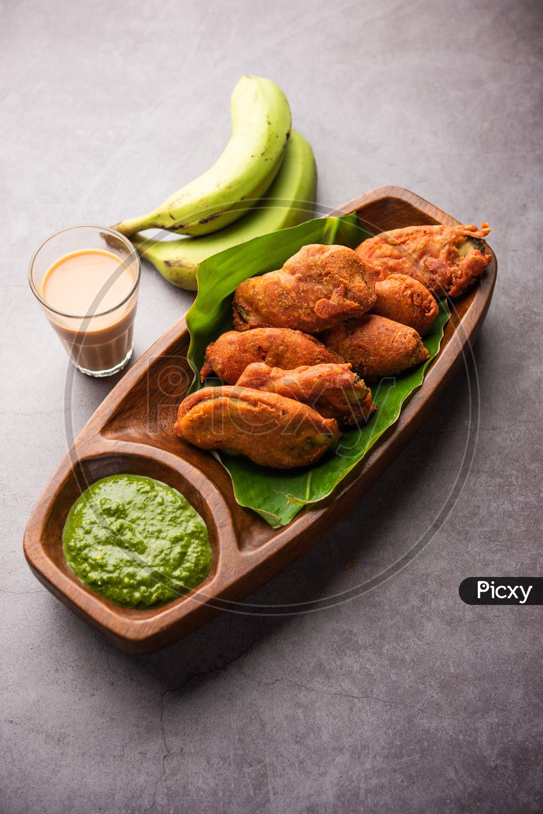 Image of Banana Fritter Or Pakora Or Raw Kela Pakoda Or Bajji Served ...