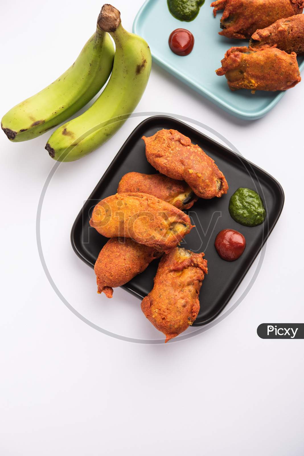 Image of Banana Fritter Or Pakora Or Raw Kela Pakoda Or Bajji Served ...