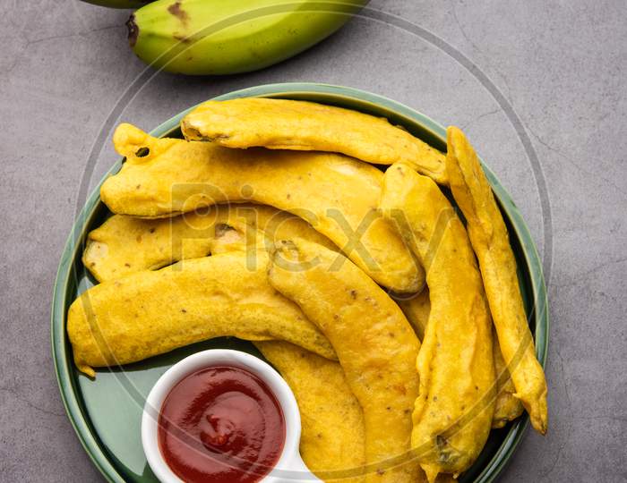 Image of Banana Fritter Or Pakora Or Raw Kela Pakoda Or Bajji Served ...