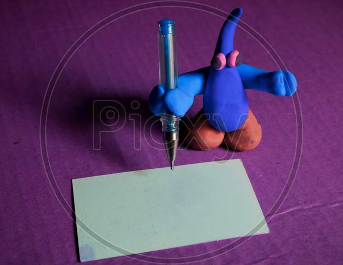 Image of Clay Cartoon Finger Hand In Blue Color With Blue Sky And Blur ...