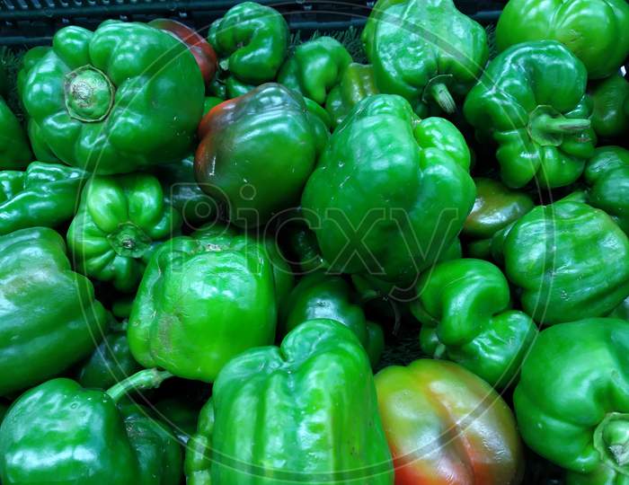 Image of Fresh peppers at vegetable market. Group of green peppers for ...
