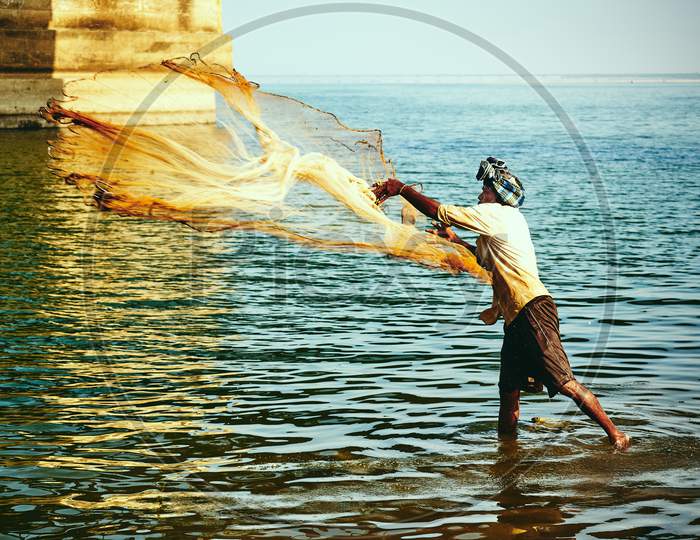 Image of Telangana Local Fisherman Throwing Fishing Nets In Water Ponds ...