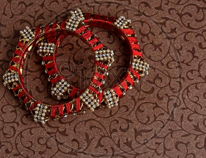 Image of Indian Red Bangles. Bracelet With Threads,Diamonds And Pearls ...