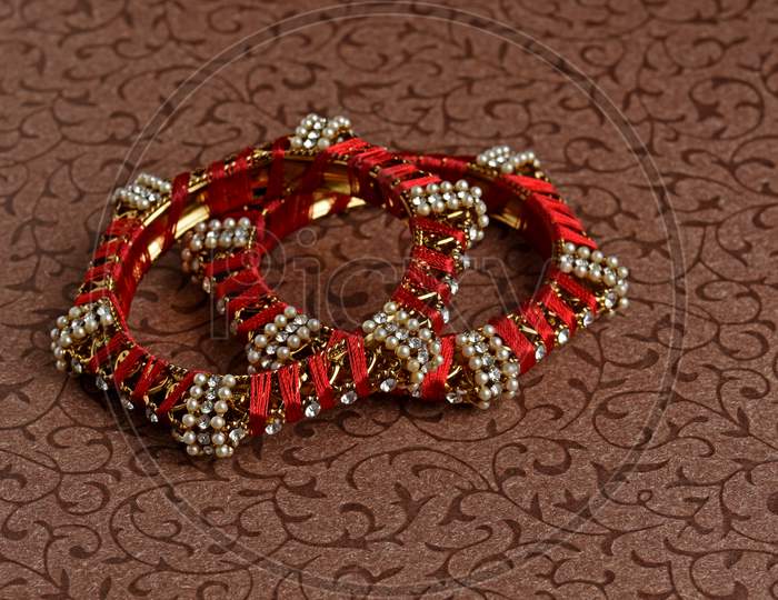 Image of Indian Red Bangles. Bracelet With Threads,Diamonds And Pearls ...