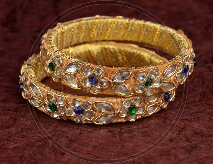Image of Indian Golden Bangles. Bracelet With Diamonds And Stones On A ...