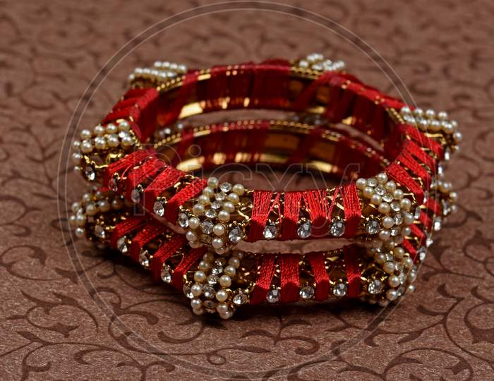 Image of Indian Red Bangles. Bracelet With Threads,Diamonds And Pearls ...