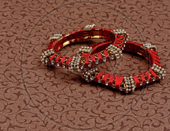 Image of Indian Red Bangles. Bracelet With Threads,Diamonds And Pearls ...
