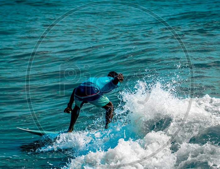 Image of Extreme Sports and Highspeed Action Photography - Picture of Surfer Man Surfing On Blue ...
