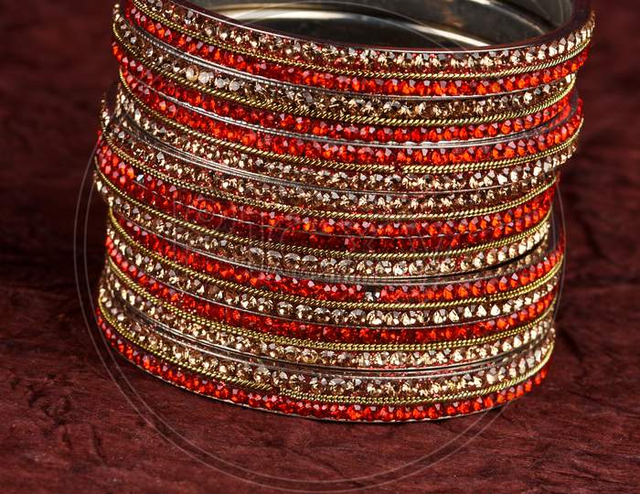 Image of Indian Red Bangles. Bracelet With Diamonds On A Textured ...