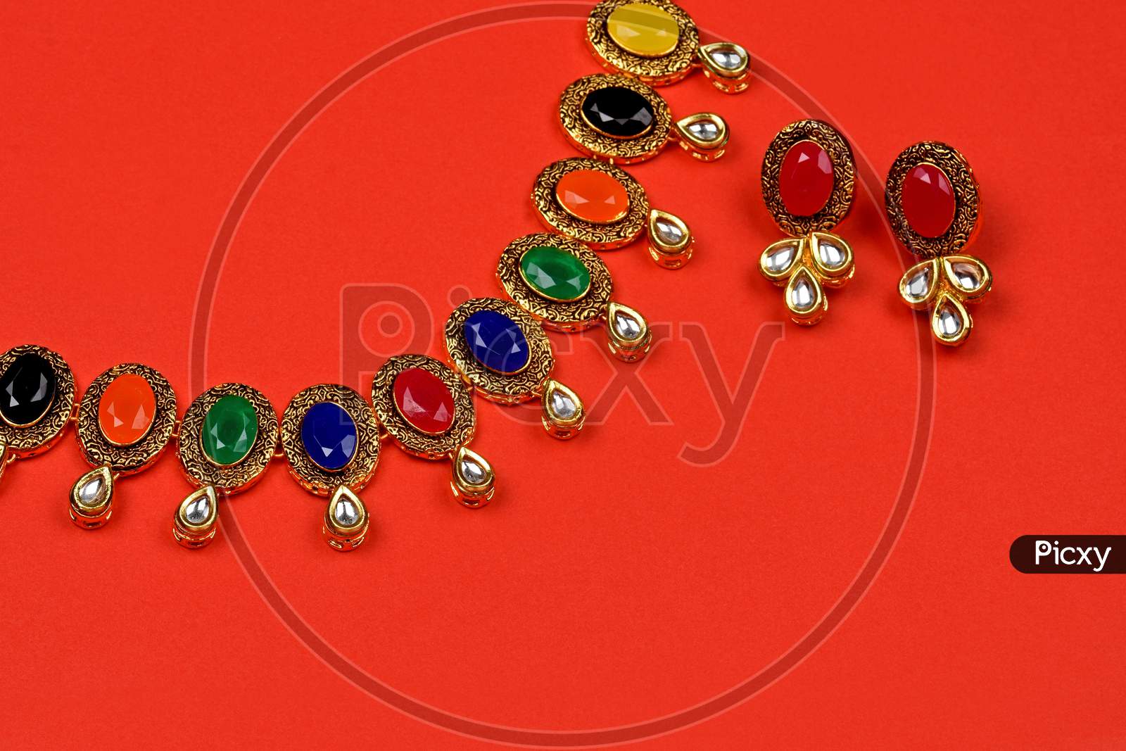 Image of Indian Traditional Jewelry On Red Background With Earrings ...