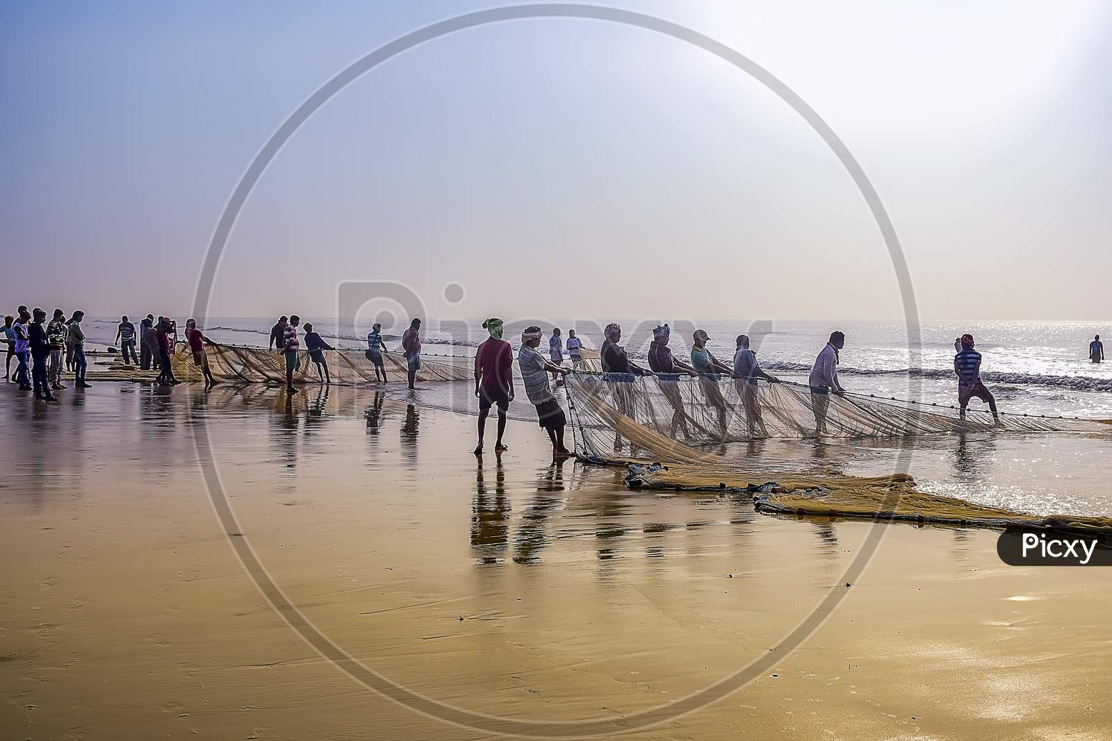 Image of Fishermen Cathing Fish In Early Morning Time After Whole Night ...