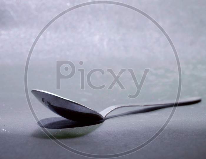 Image of Stainless Steel Single Spoon Isolated On Gray Backdrop ...