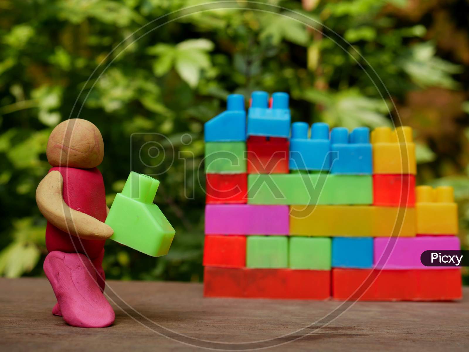 Image of Clay Man Cartoon Toy Making Block House At Natural Park Green ...