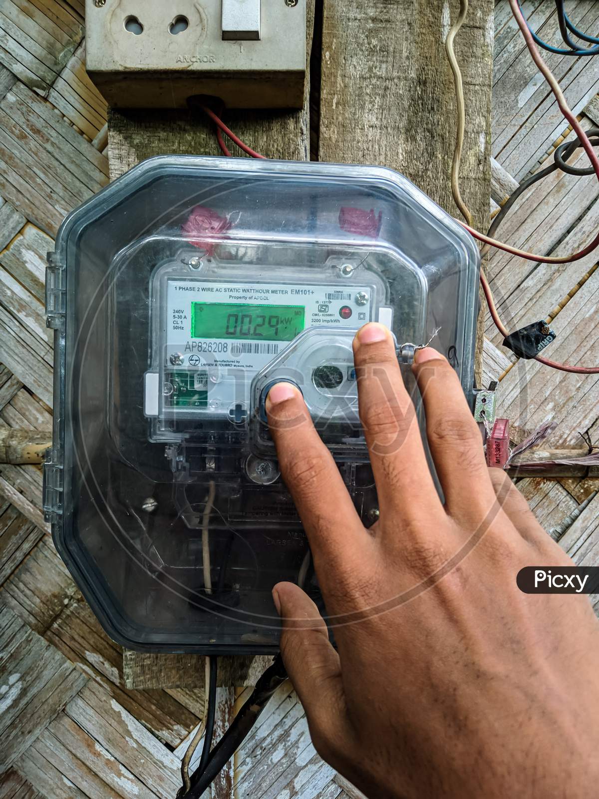 Image of Fingers pointing electric meter readings-OQ187401-Picxy