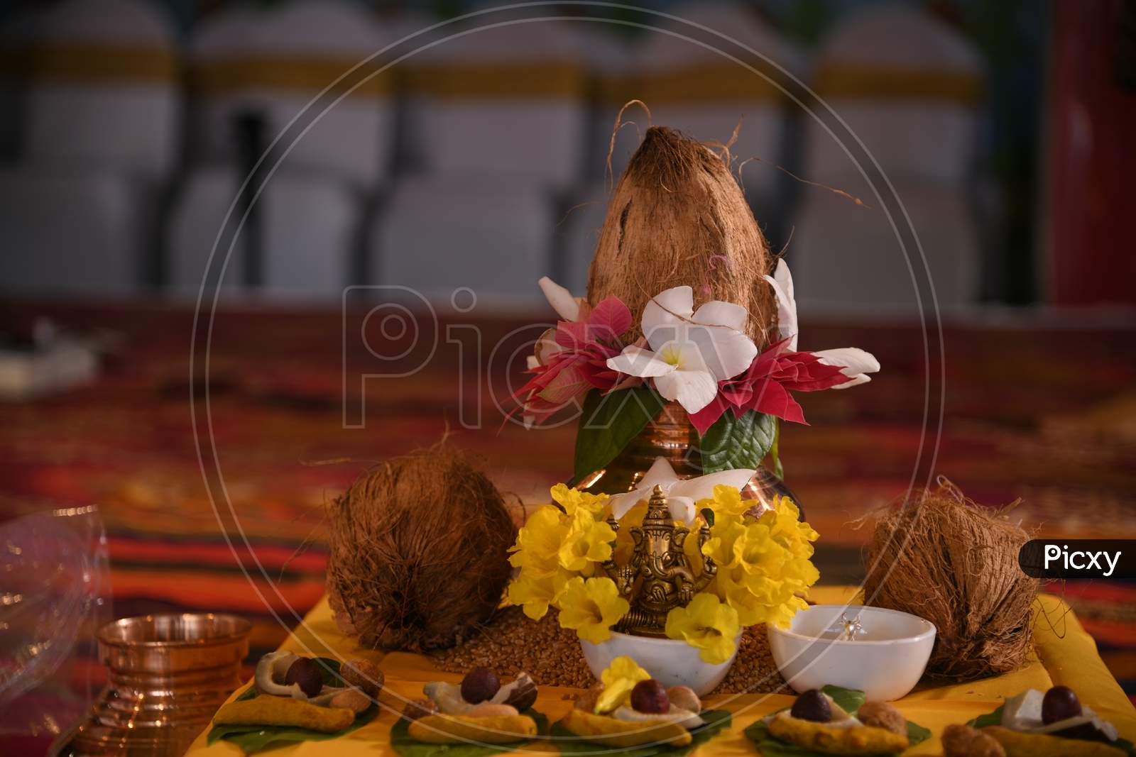 Image of lord ganesha idol with kalash and coconut in puja ceremony ...