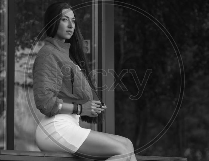 Image Of Young Beautiful Dark Haired Woman With A Slender Figure Is