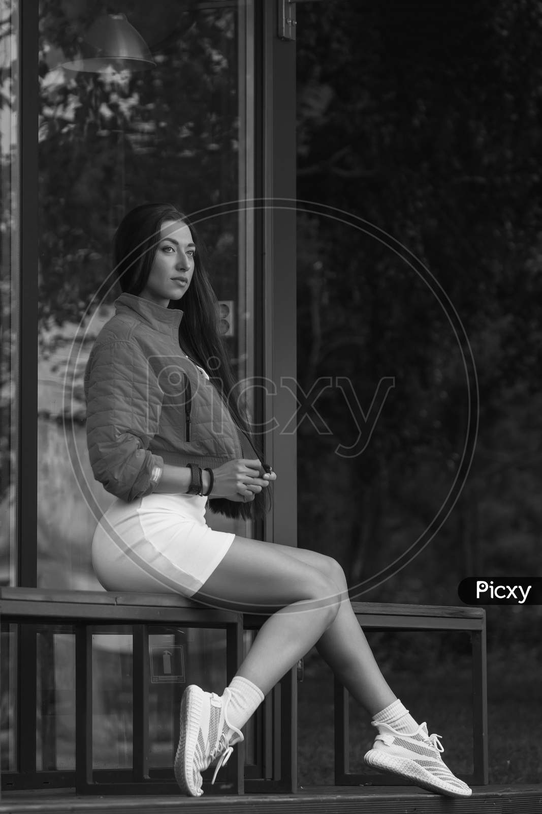 Image Of Young Beautiful Dark Haired Woman With A Slender Figure Is