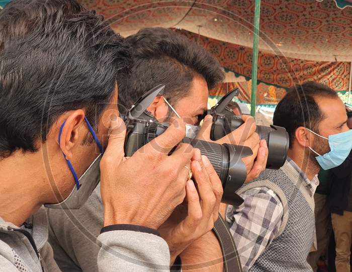 Image of Photographer Clicking Photos-QA704320-Picxy