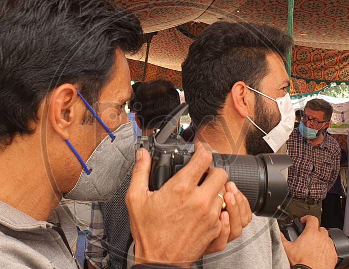 Image of Photographer Clicking Photos-QA704320-Picxy