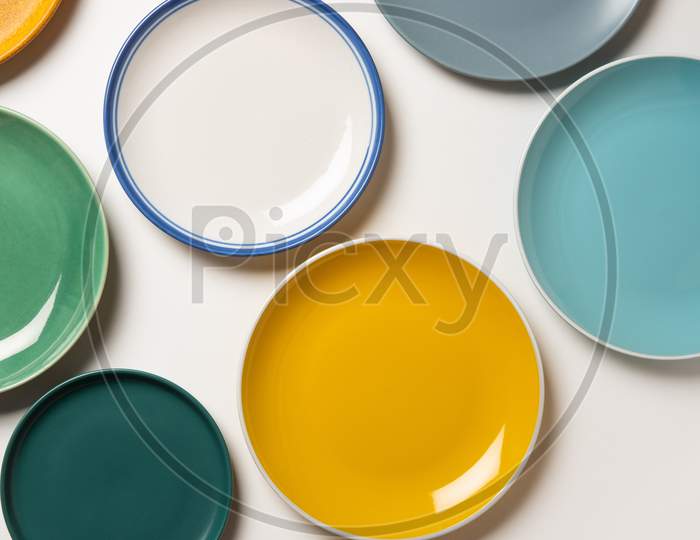 Image of Empty Colourful Ceramic Plates In Group Over White Background ...