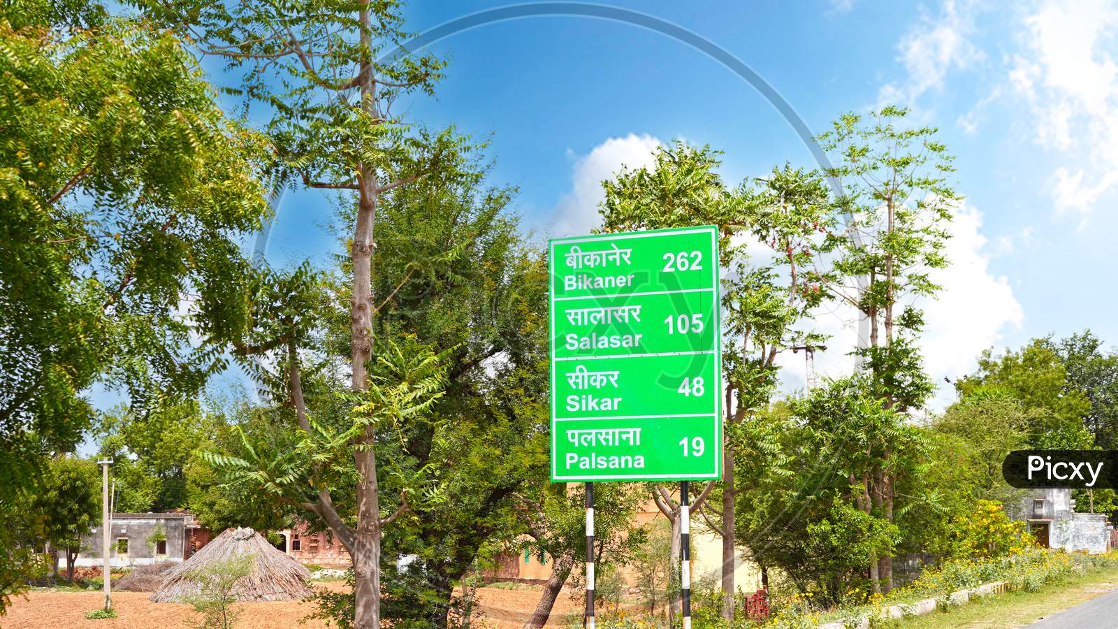 Image of Post Sign Board To Inform About Some Cities Distance With ...