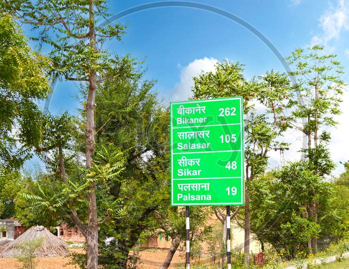 Image of Post Sign Board To Inform About Some Cities Distance With ...