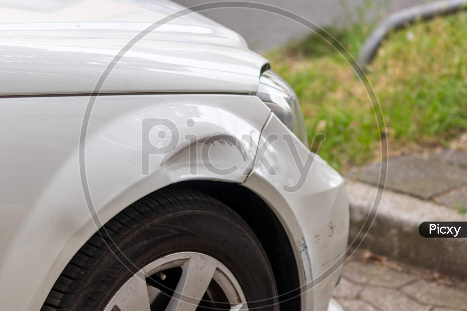 Image of Dented car wing and fender with scratches and bumps after ...