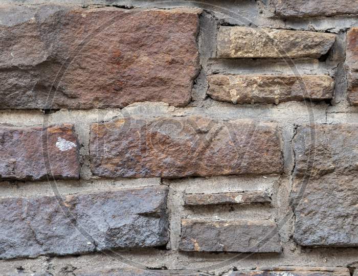 Image of Massive stone wall with rough rocks like a castle wall with different bricks as natural ...