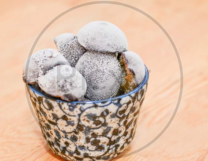Image of frozen plums prepared on the table-MM551557-Picxy