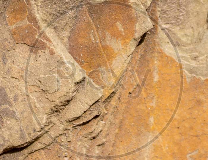 Image of Raw rock in orange with minerals and metals as natural stones ...